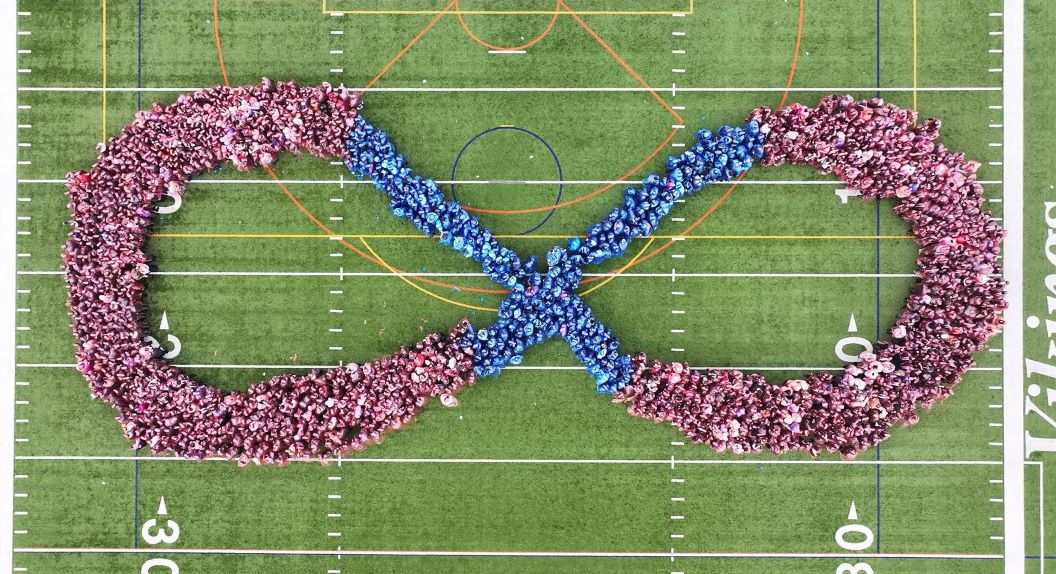 Largest human image of an infinity symbol | Guinness World Records